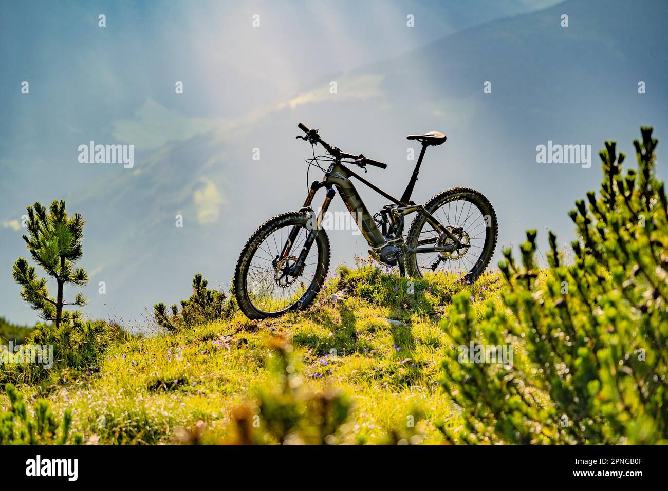 On a sunny summer day on the road with the e-bike in the Zillertal Alps, off paved roads paths ...