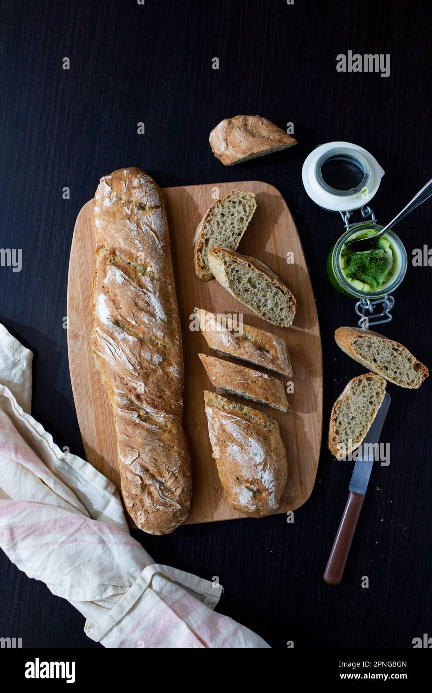 Fresh French home made Baguette Bread with wild garlic on dark ...