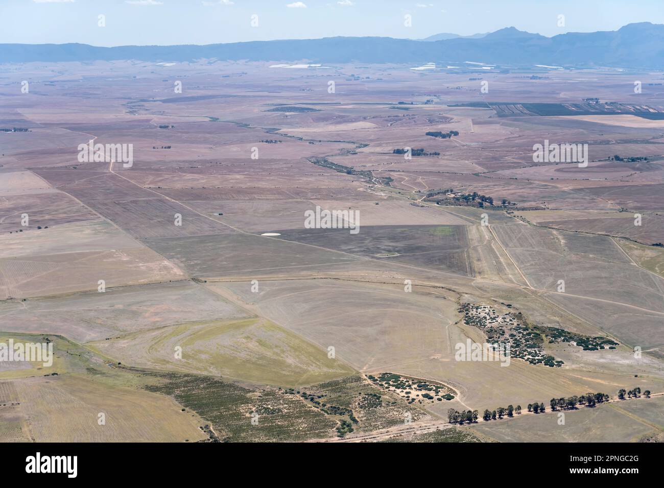 aerial landscape, from a glider, with cultivated fields and farms in ...