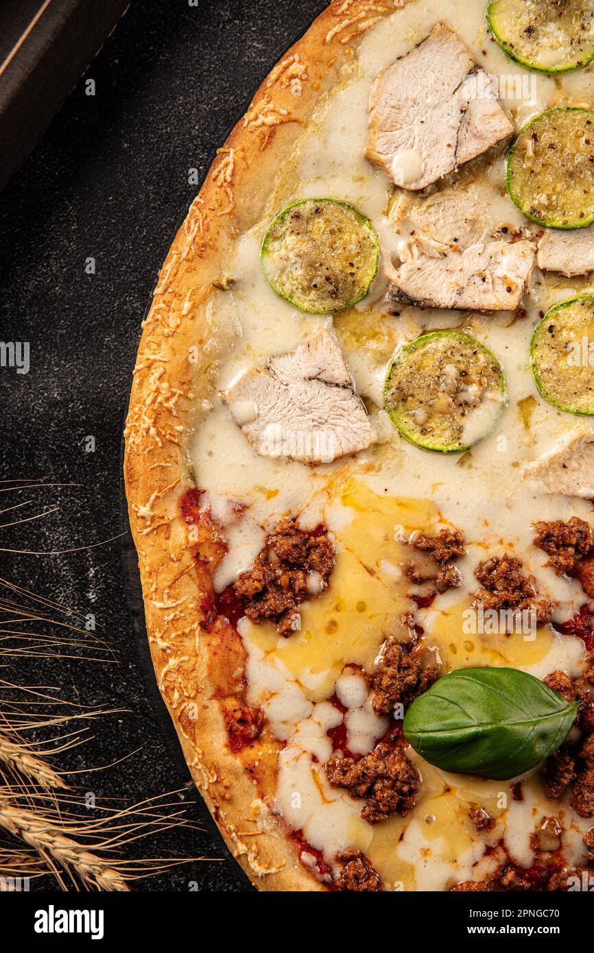 Big assorted pizza with variety of toppings Stock Photo - Alamy
