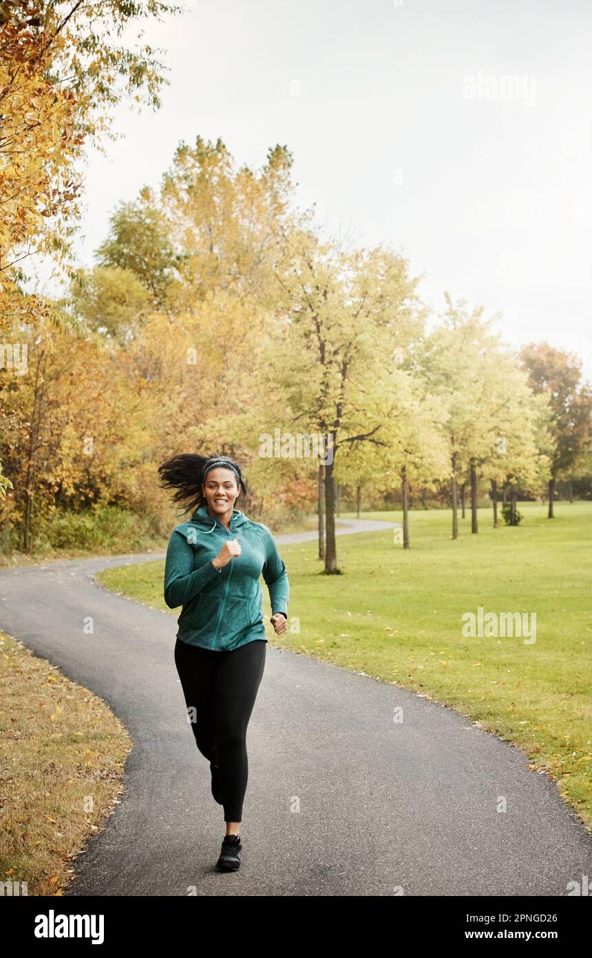 Dont stop me now. Portrait of an attractive young woman going for a run ...