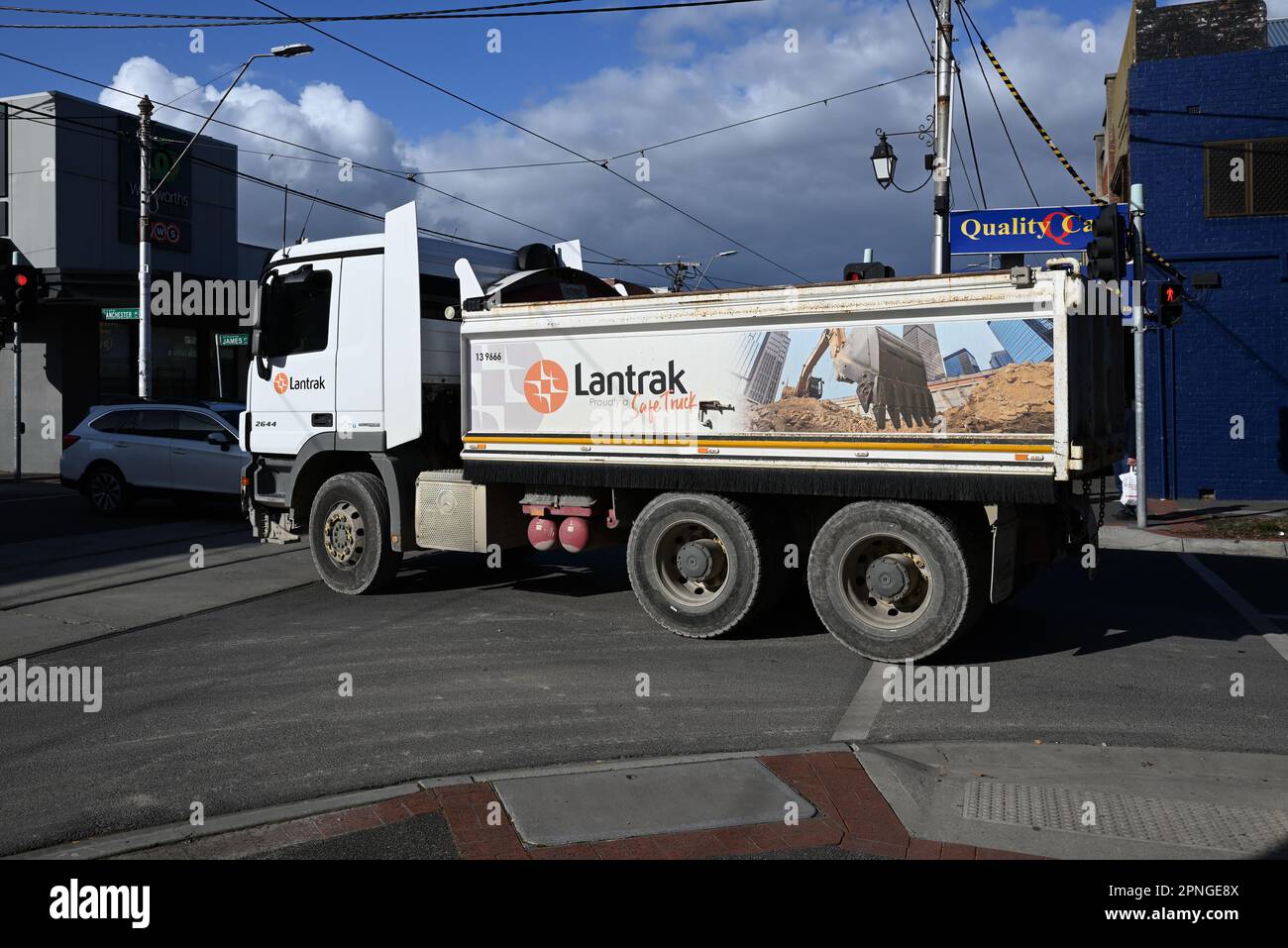 Side of a Lantrak truck, a Mercedes-Benz Actros 2644, as it turns at an intersection in ...