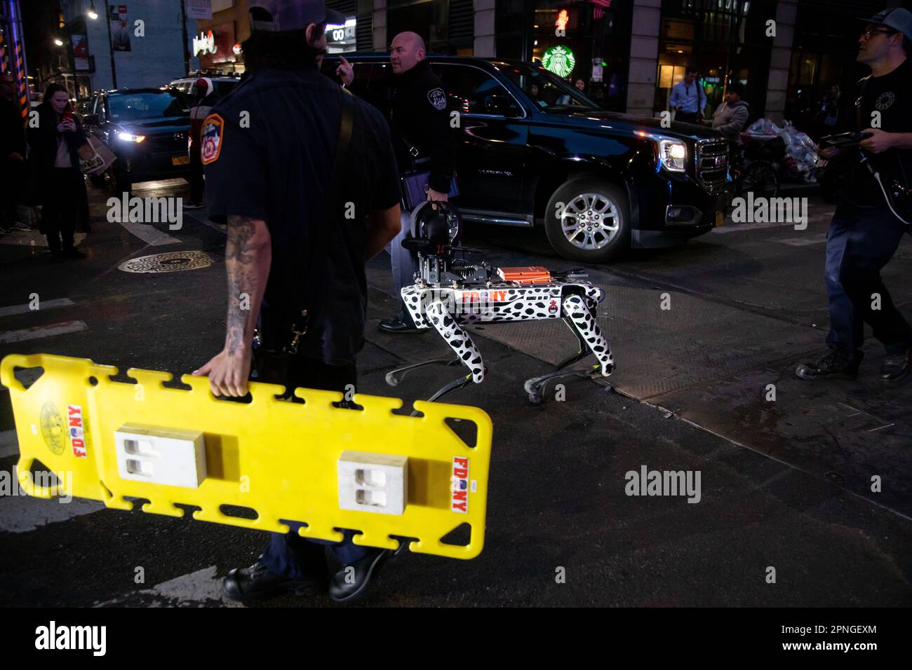 New York, USA. 18th Apr, 2023. Emergency workers escort a robot dog at ...