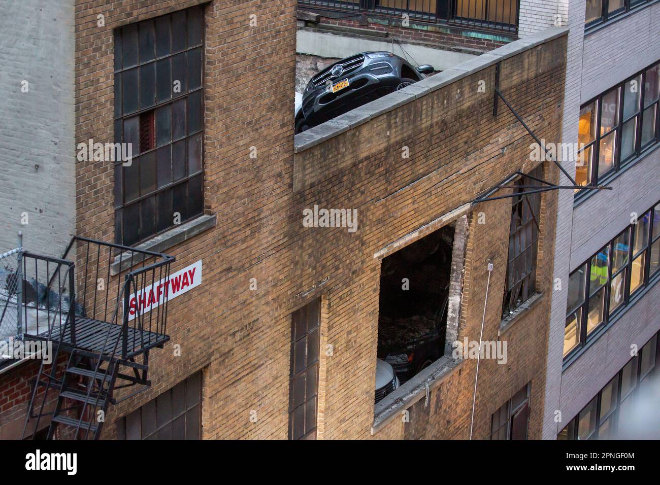 New York, USA. 18th Apr, 2023. A car is parked on the roof of a partial ...