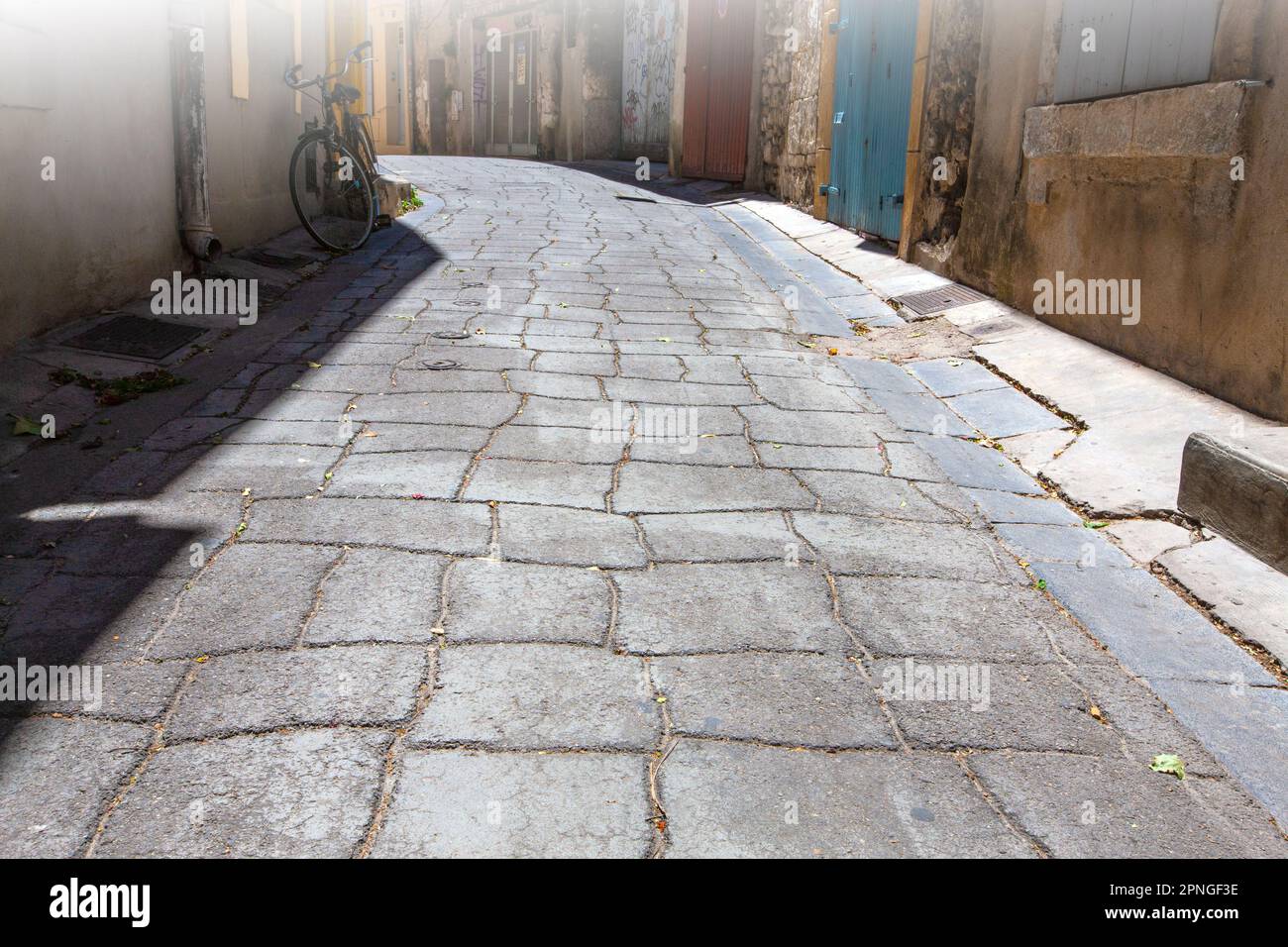 Traditional narrow streets with cobblestone pavement in france Stock ...