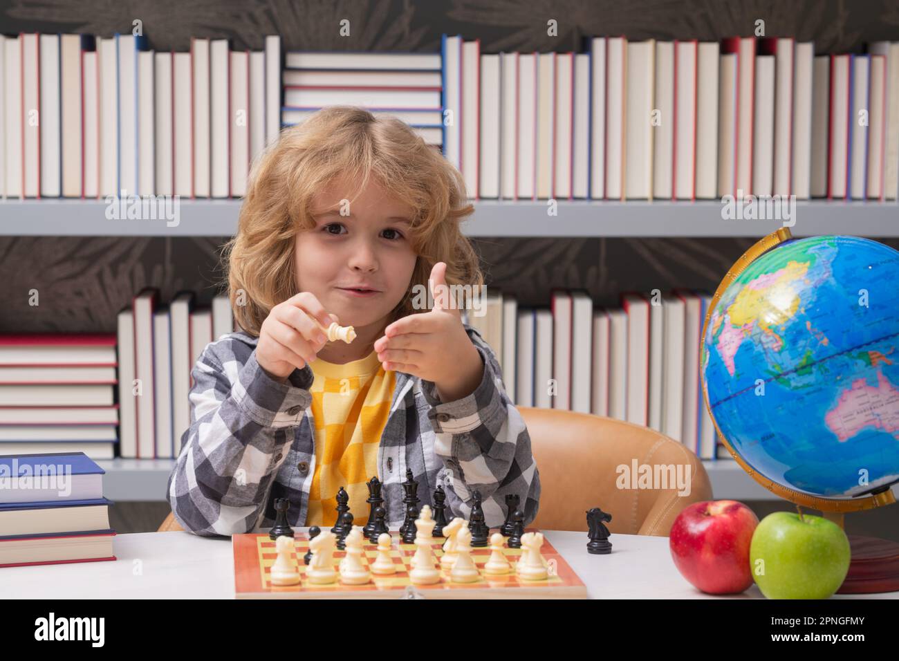 Play chess. Chess for intelligent kid. Child genius, smart pupil ...