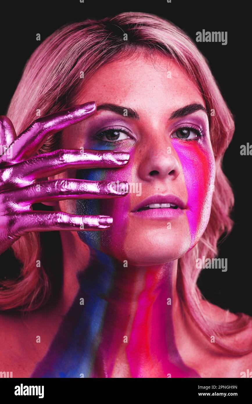Woman, hand on face and beauty portrait with metallic color paint ...