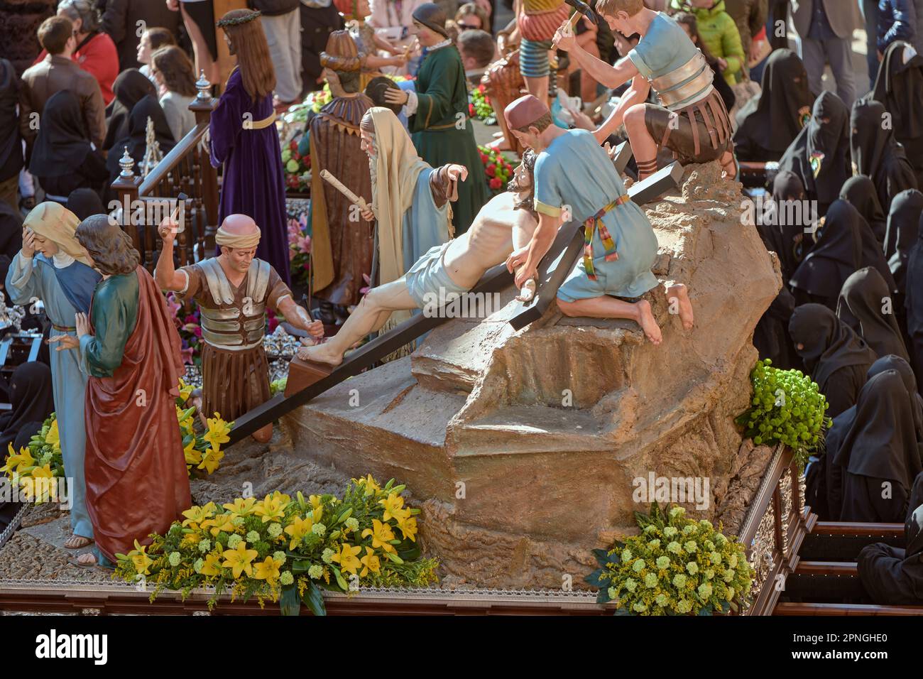 A group of people gathering together in a religious setting, all ...