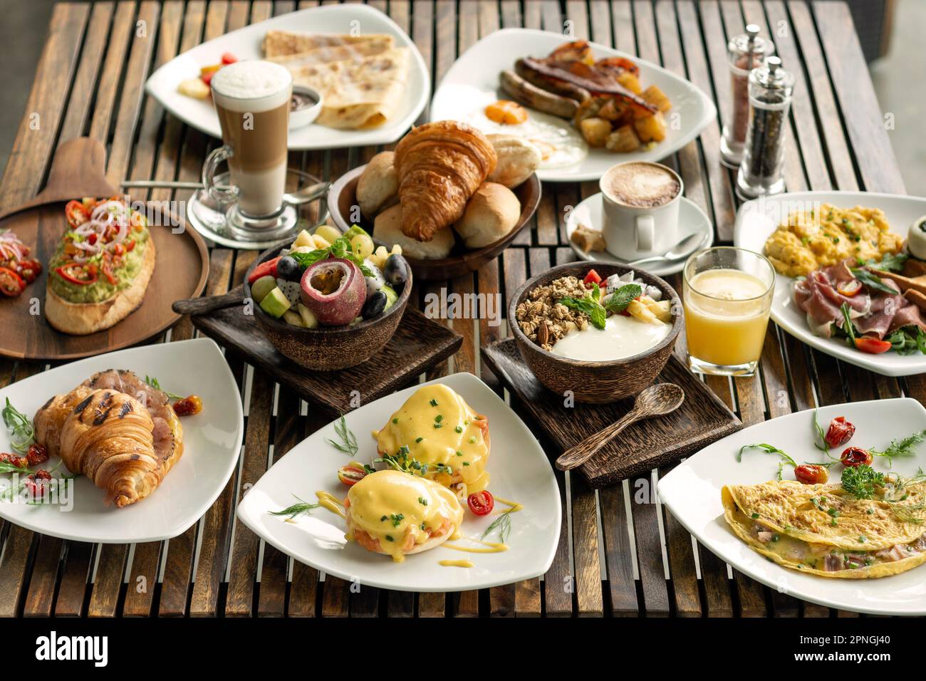many mixed western breakfast food items on cafe table Stock Photo - Alamy