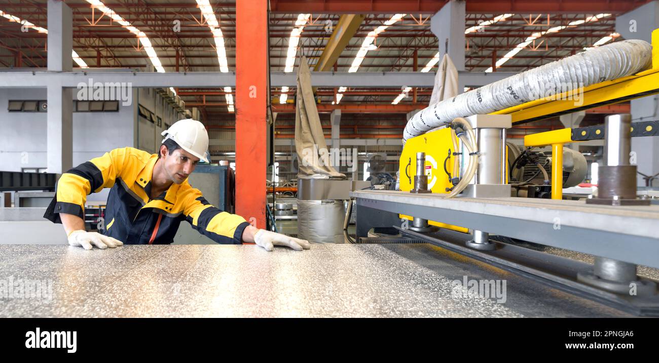 Young hispanic labor dressed in polyester jacket uniform, hardhat and ...