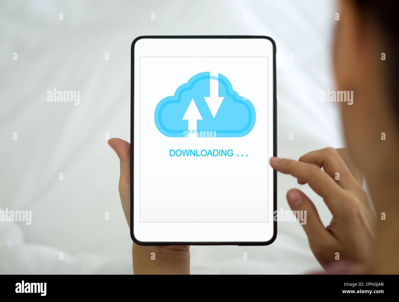 Back view of woman using cloud drive technology download or upload save ...