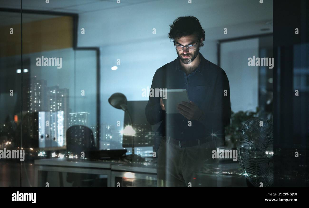 Business man, tablet and serious in office, online browsing or web ...
