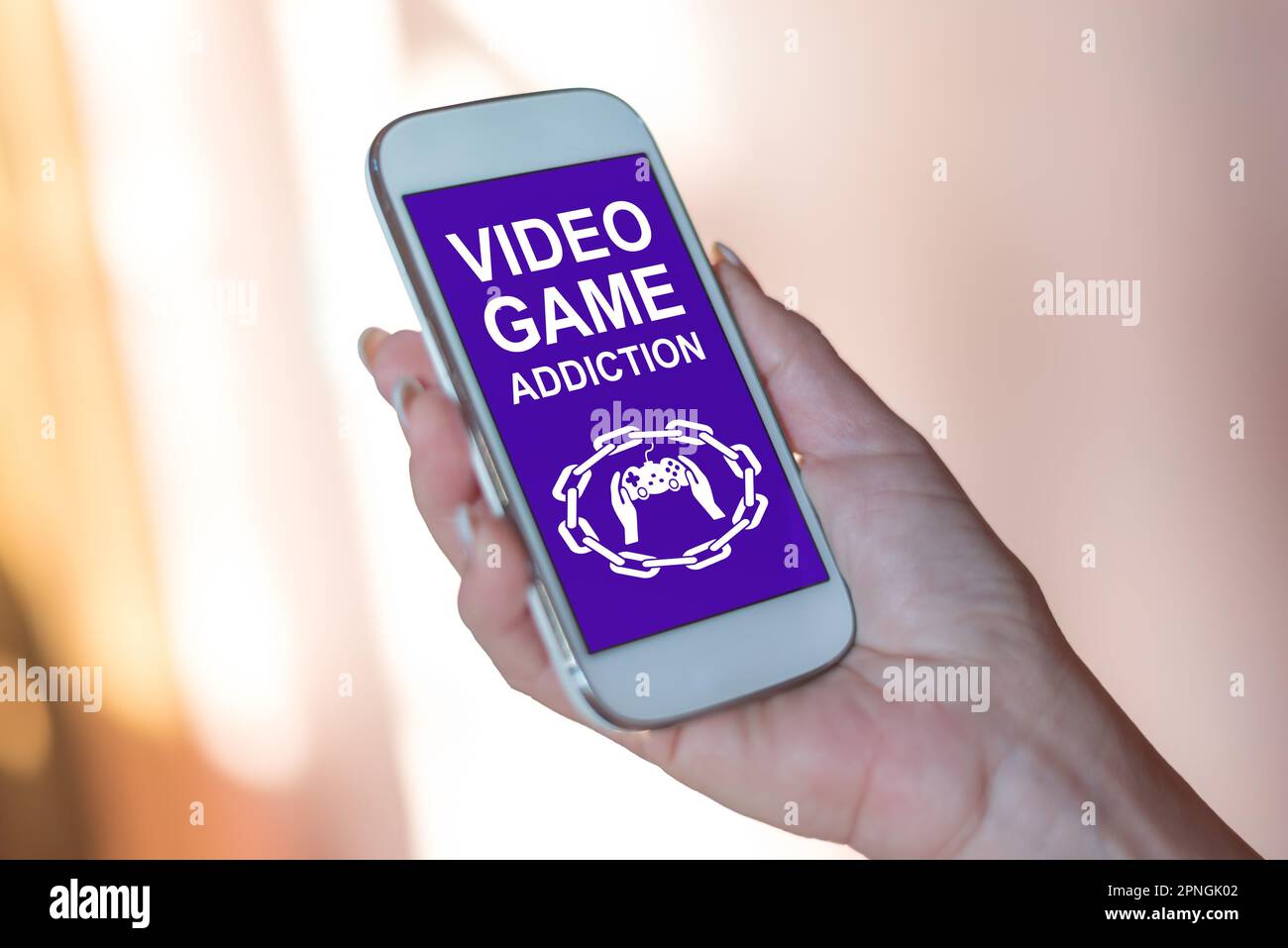 Smartphone screen displaying a video game addiction concept Stock Photo ...