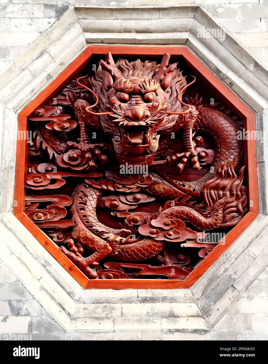 A red dragon relief sculpture on a wall in Xian, China Stock Photo - Alamy