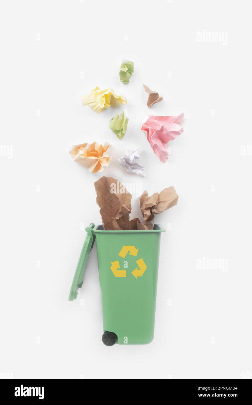 Trash bin and paper garbage on white background, top view Stock Photo ...