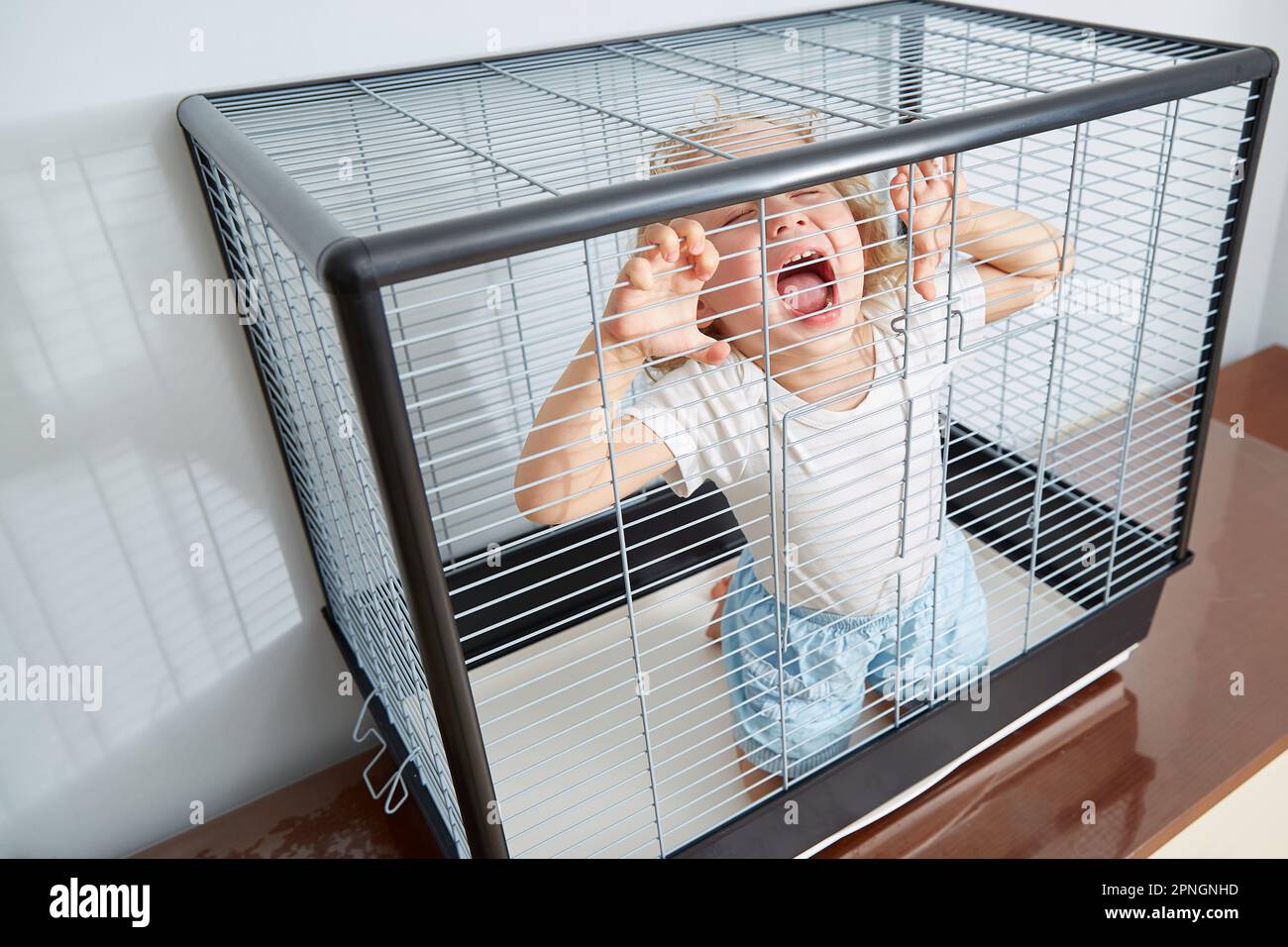 Cute scared girl sitting in hi-res stock photography and images - Alamy