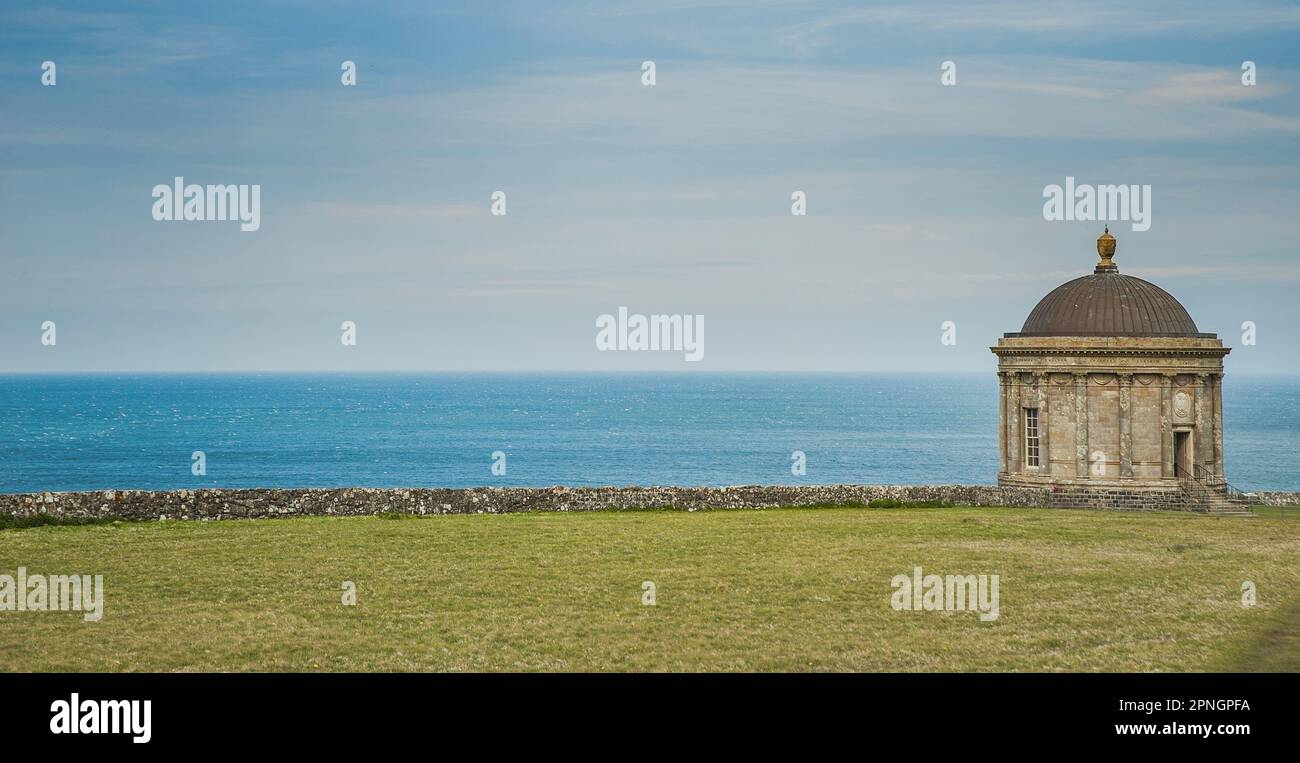 Historical temple on the verge of a cliff overlooking blue ocean 's ...