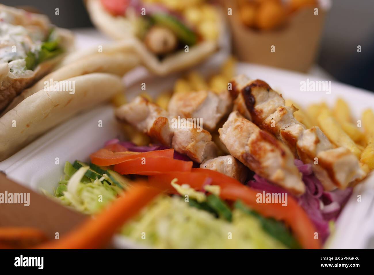 Grilled souvlaki meat served in a Greek fast food restaurant for lunch ...