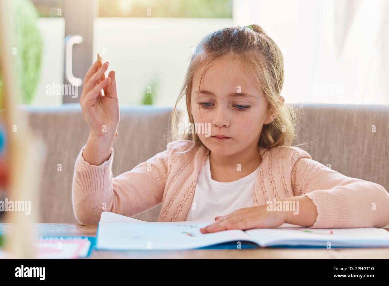 Homework, education and girl with focus, notebook and thinking in ...