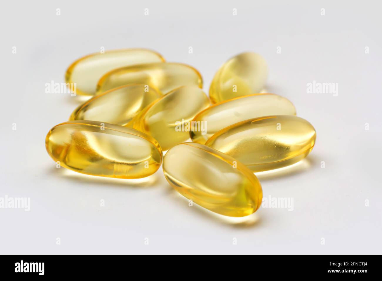 Fish oil capsules omega 3 on light background. Transparent yellow ...