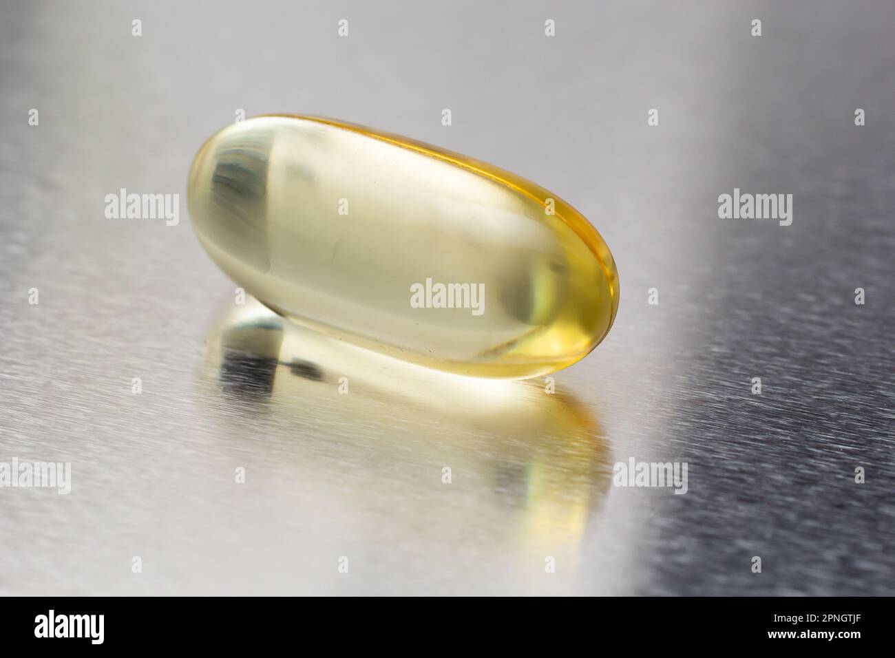Fish oil capsules omega 3 on light background. Transparent yellow ...