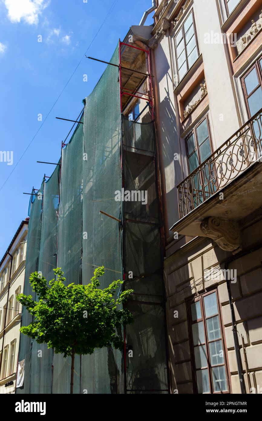Restoration of the building. Scaffolding and protective green building ...