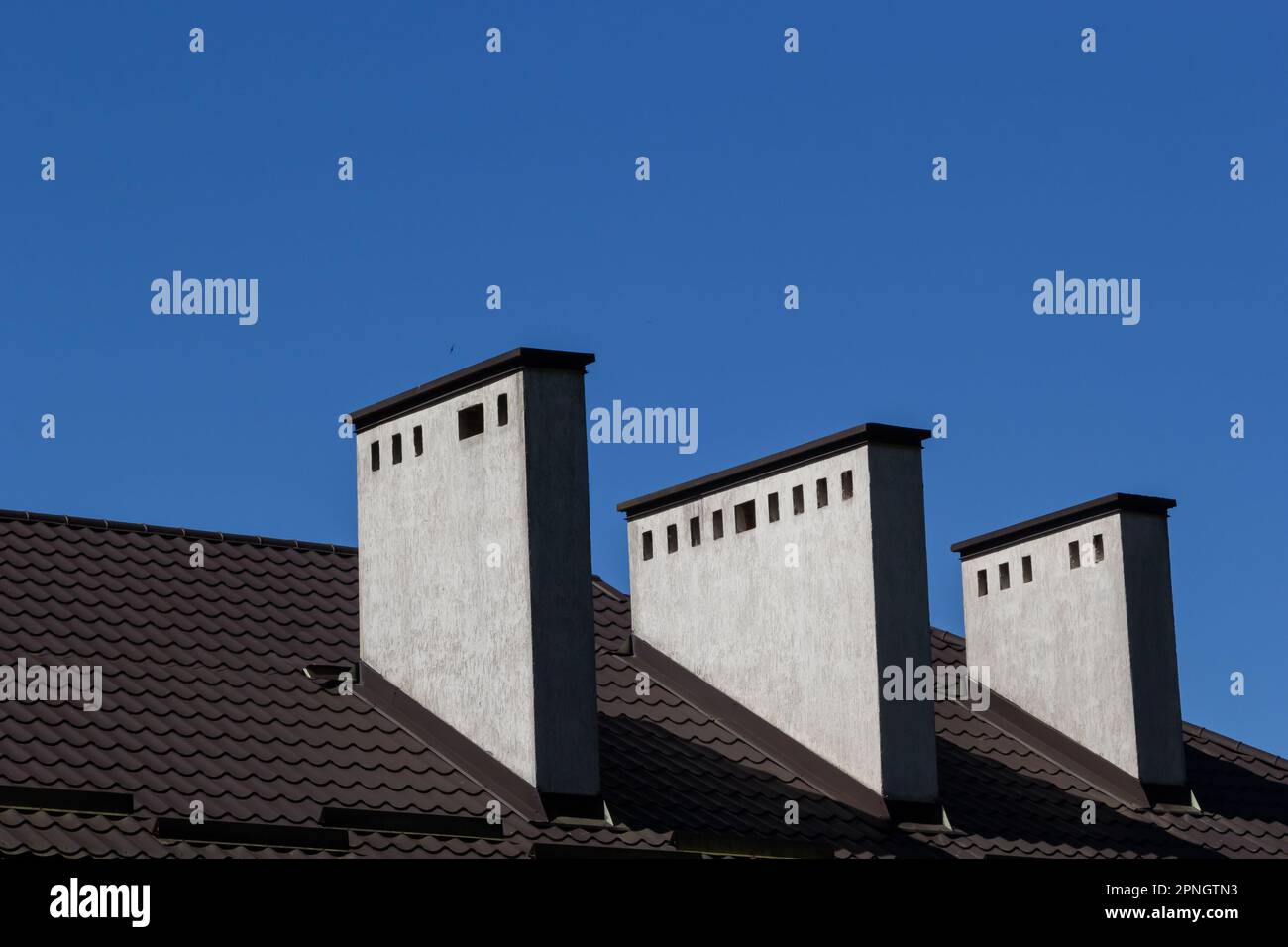 Red house roof with red brick chimney. Ceramic chimney, metal roof tiles, gutters Stock Photo ...
