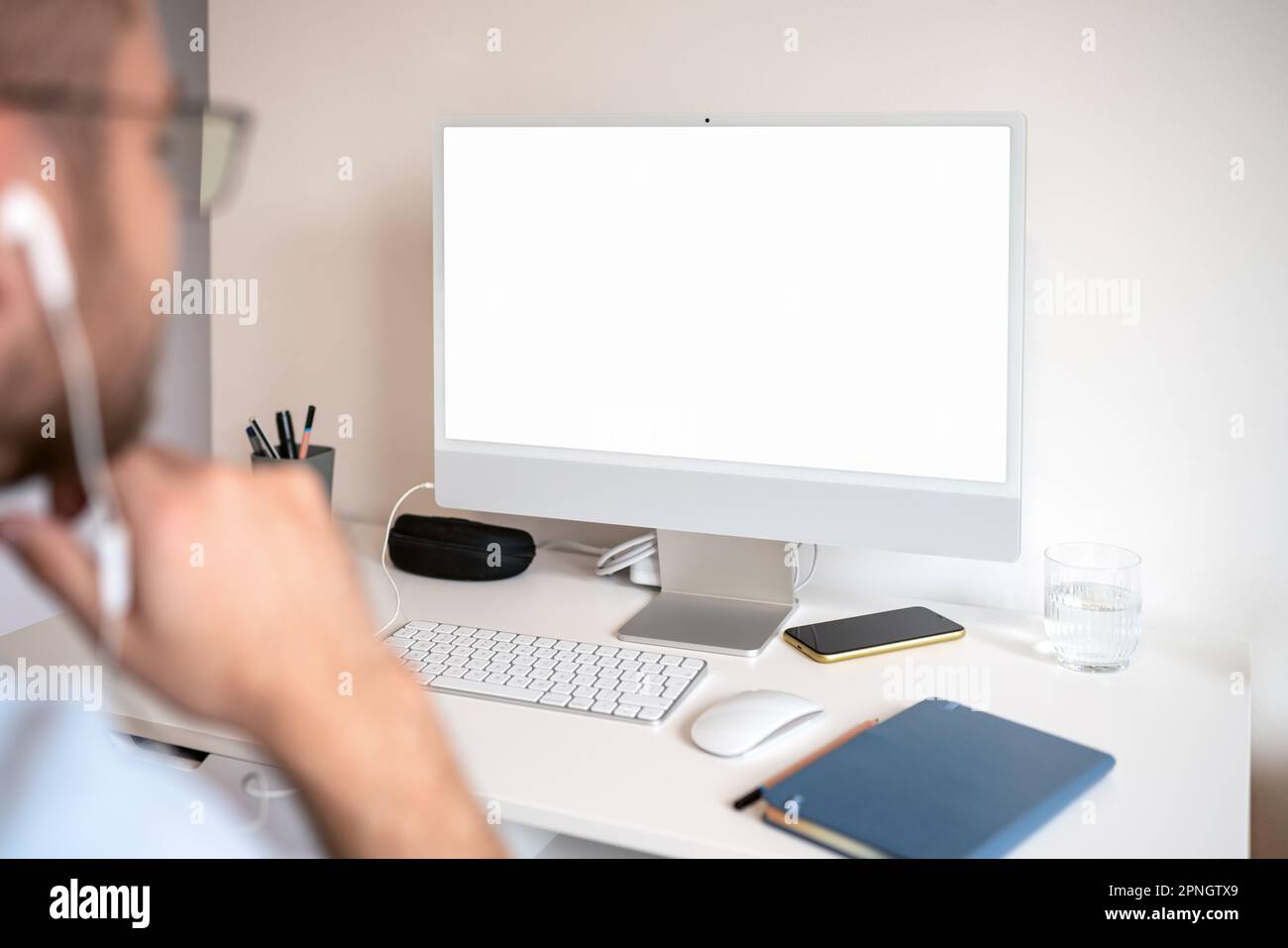 Blank computer screen on desk at office, male person looking at pc ...