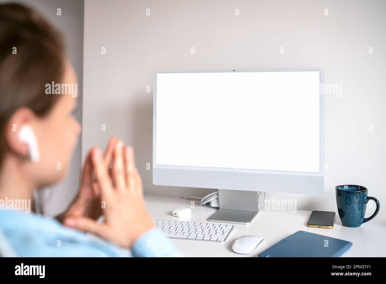 Blank screen of computer monitor and woman looking at screen Stock ...