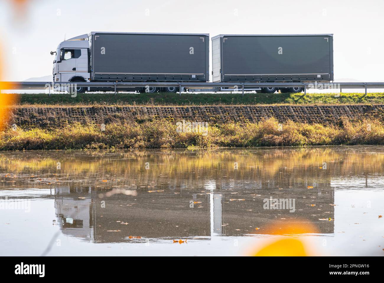 Truck goes on the road in autumn. car transport . Truck with semi ...