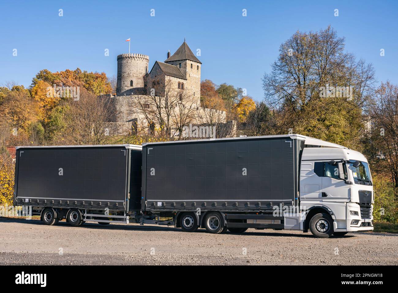 Truck on the background of the castle. Truck with semi-trailer in gray ...