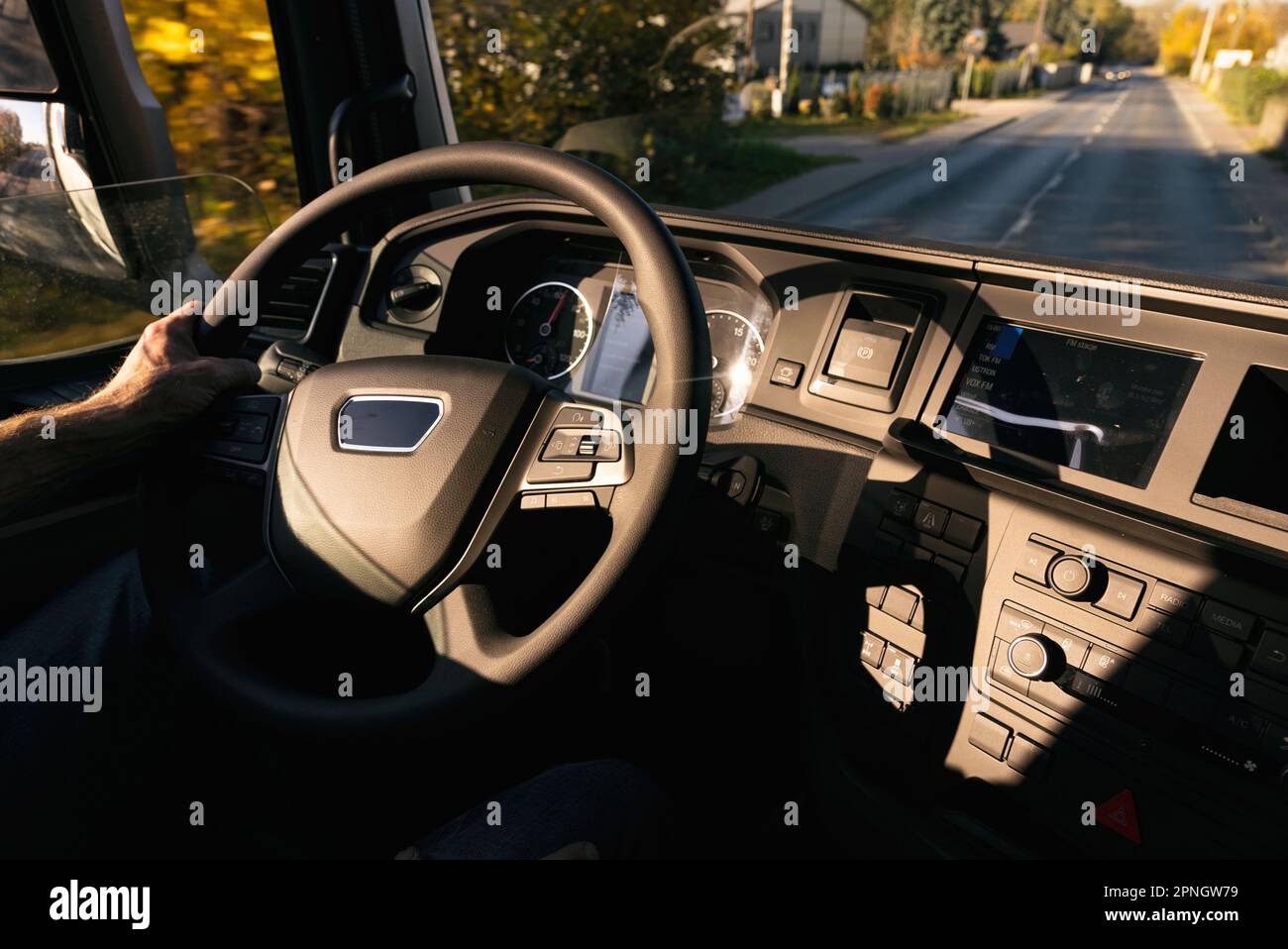 View from inside the cab of the truck. Car transport. The truck is ...
