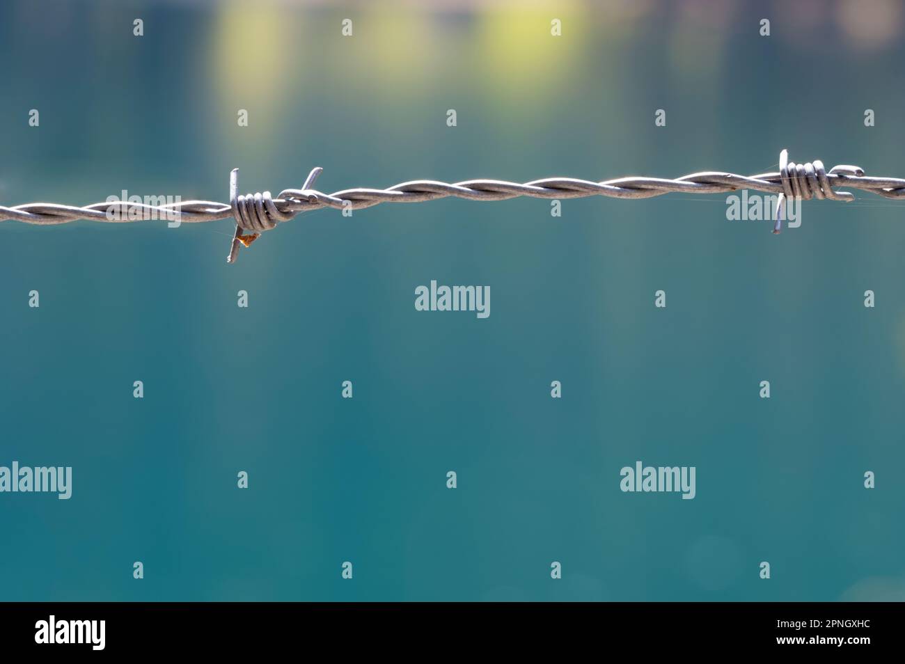 Blurred background with macro close up of pointed sharp steel metal ...