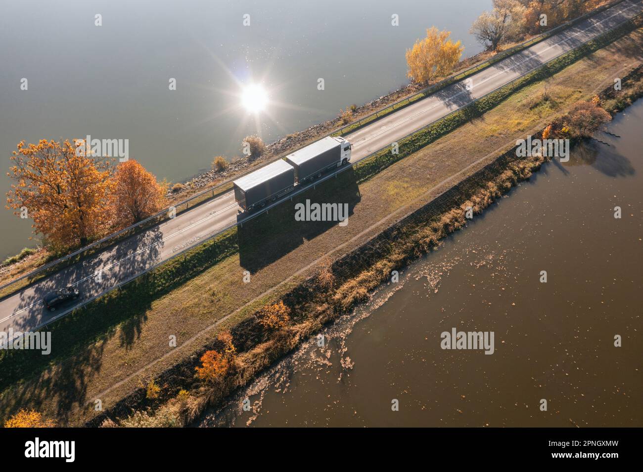 Truck goes on the road in autumn. car transport . Truck with semi ...