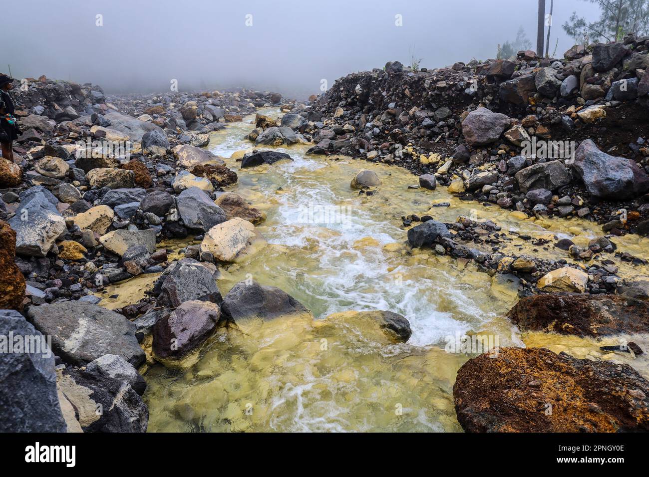 Sulphur rich river flowing down from the peak of Mount Rinjani in ...
