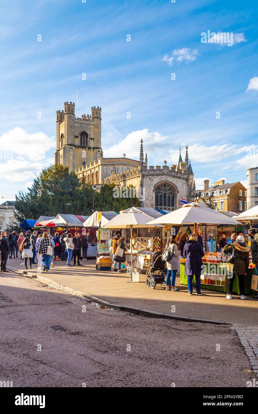 Stalls at Cambridge Market Square with Great St Mary's Church in the ...