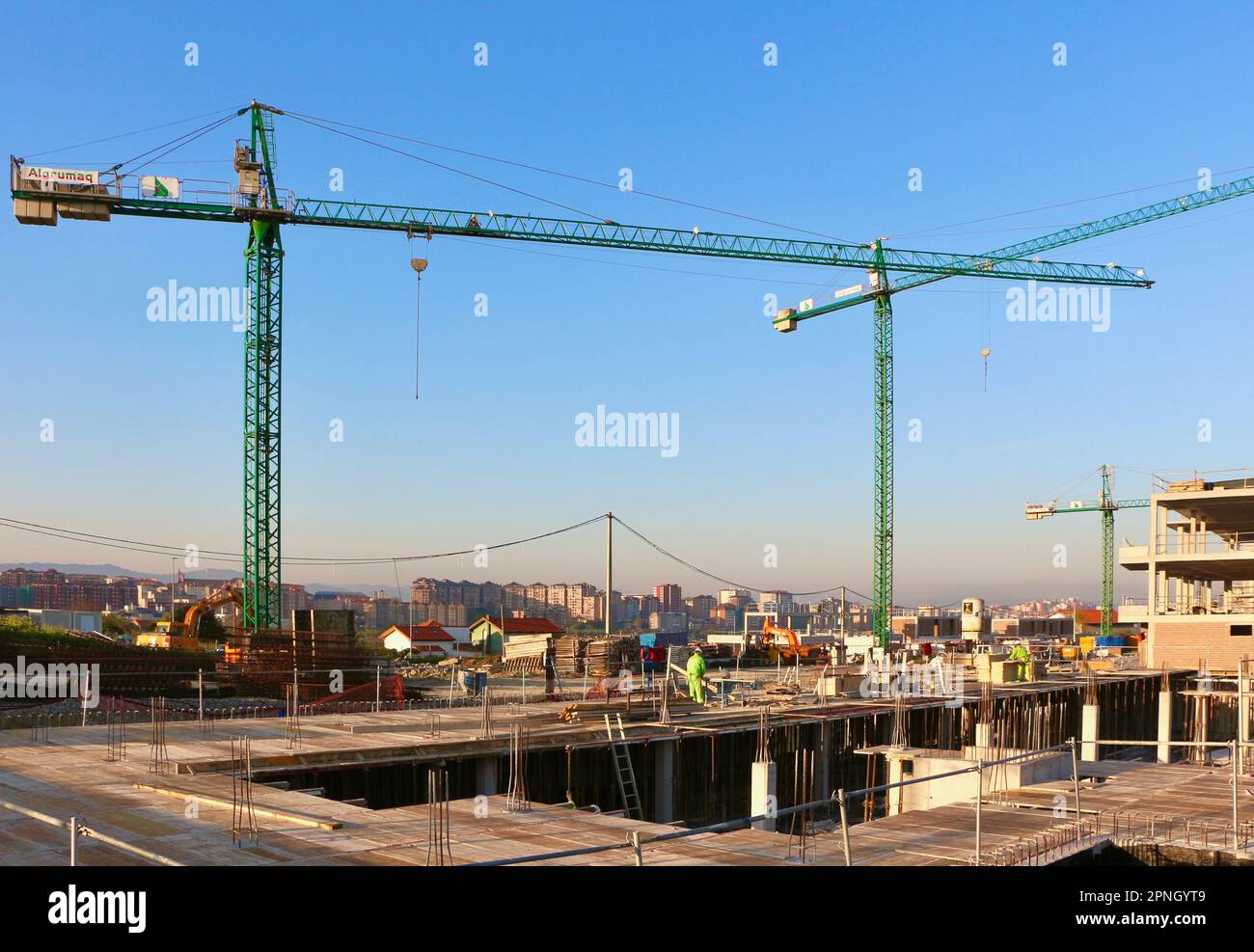 Building site with tower cranes for new properties with reinforced ...