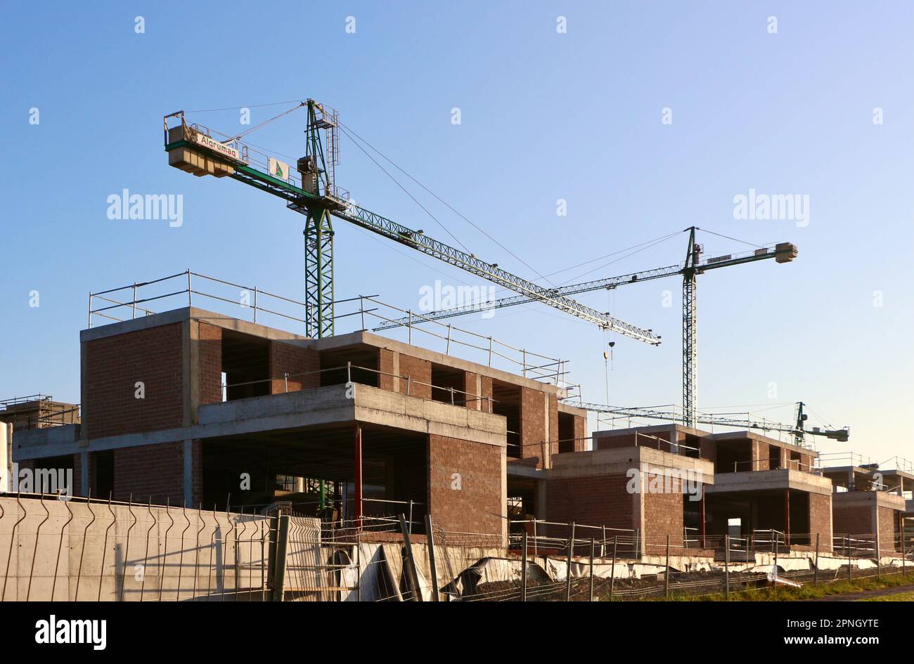 Building site with tower cranes for new properties with reinforced ...