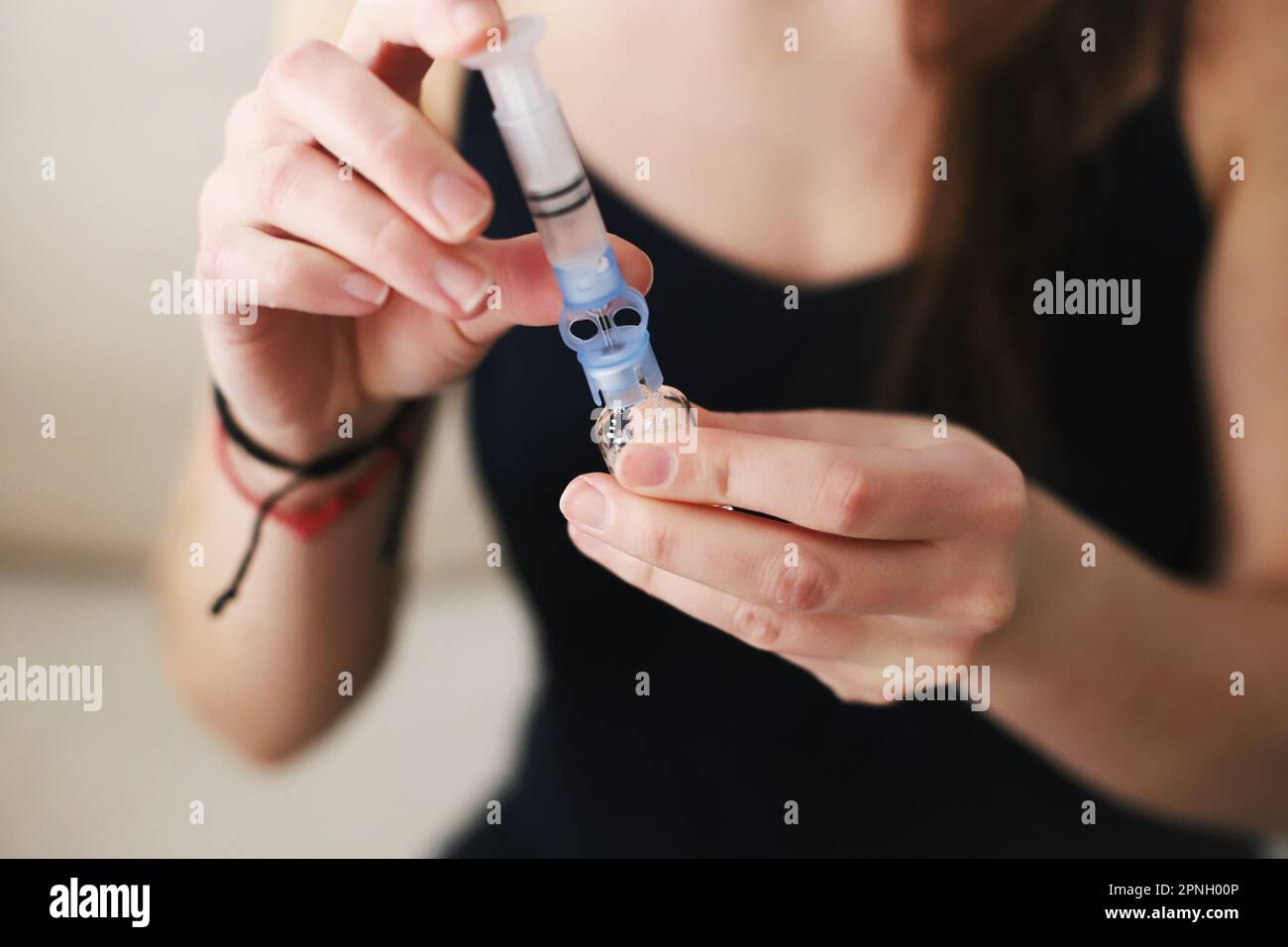 Woman filling up the reservoir of her insulin pump with insulin Stock ...