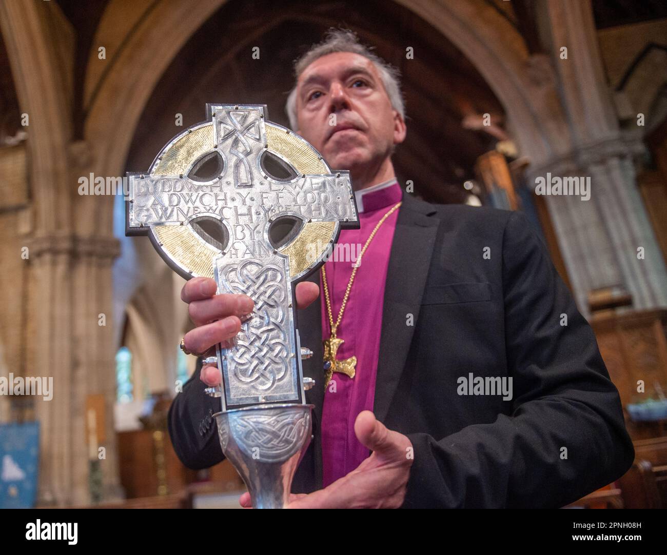 Archbishop of Wales Andrew John with The Cross of Wales ahead of a ...