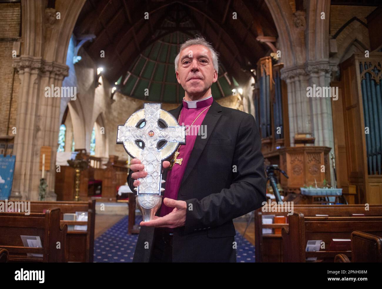 Archbishop of Wales Andrew John with The Cross of Wales ahead of a ...