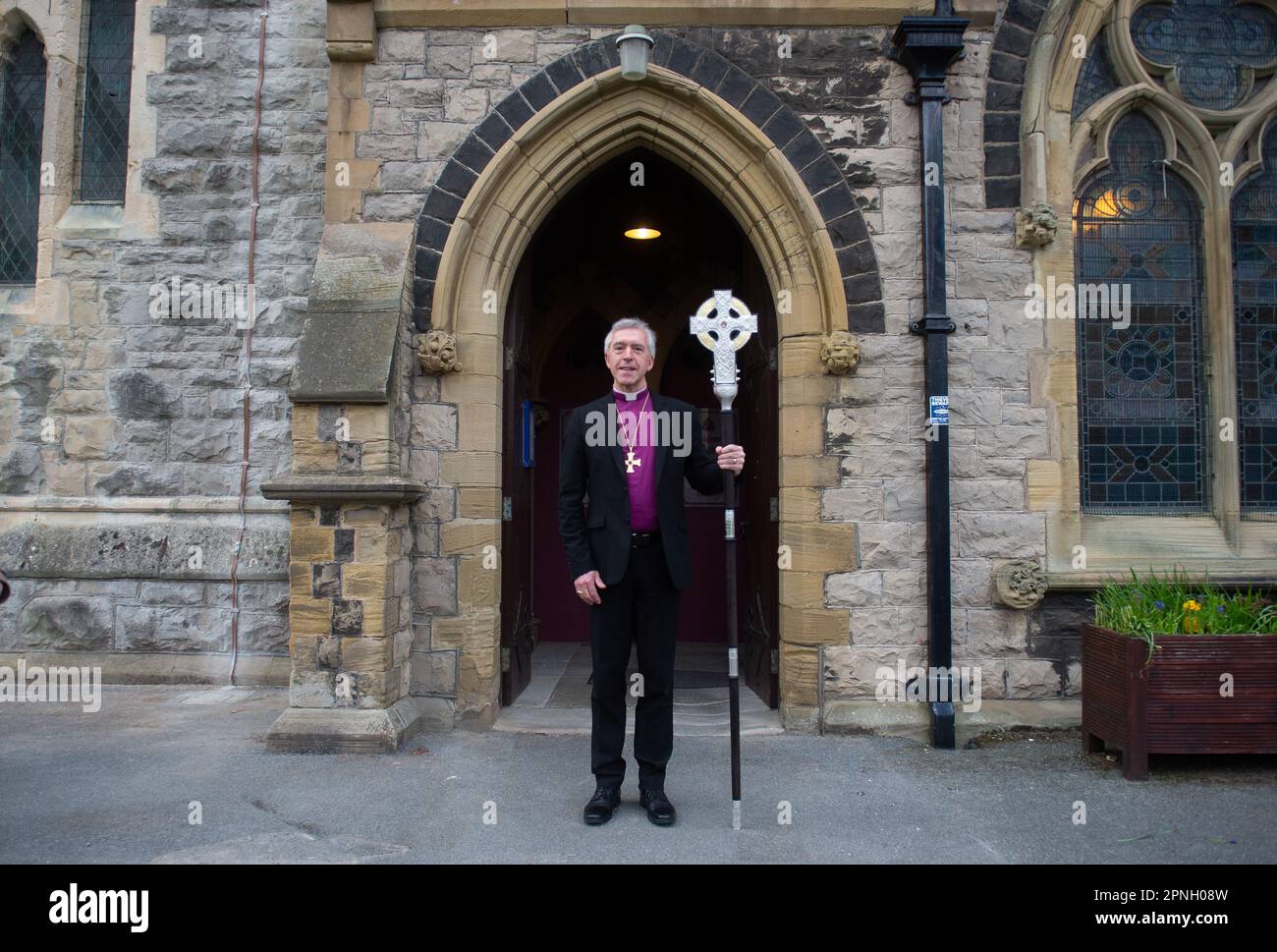 Archbishop of Wales Andrew John with The Cross of Wales ahead of a ...