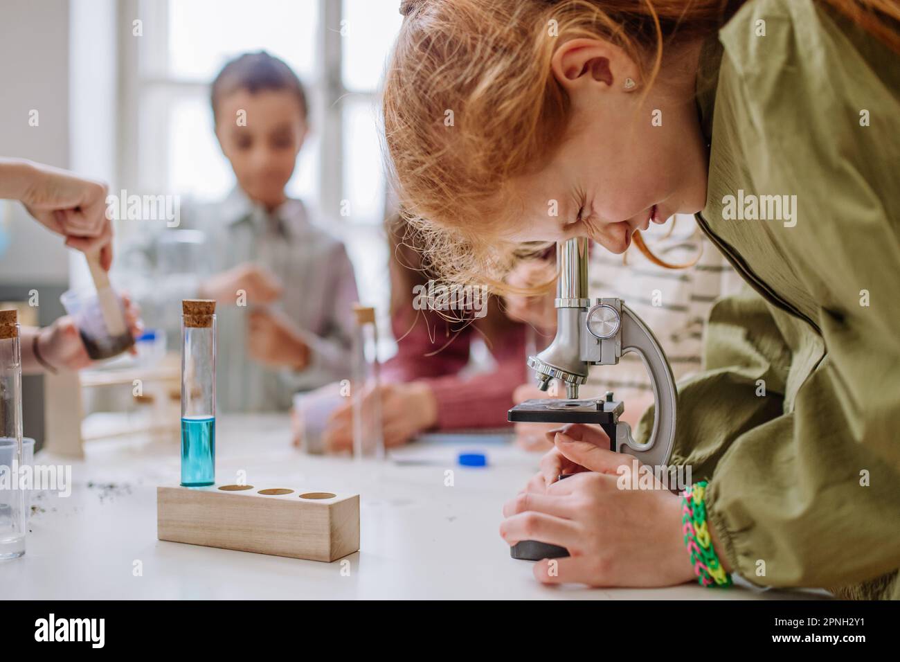 Children doing chemistry experiment during science education Stock ...