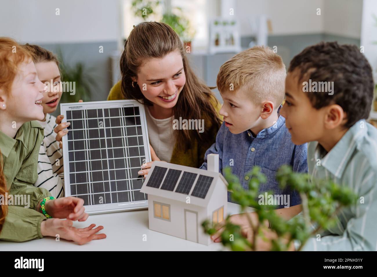 Young teacher with solar panel learning pupils about solar energy Stock ...