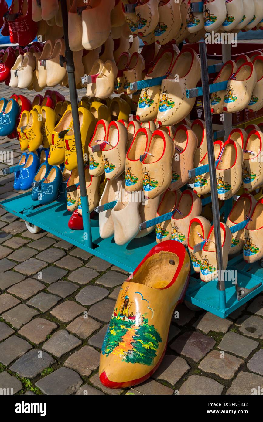 Clogs hanging from rack on display for sale at Gouda, Holland ...