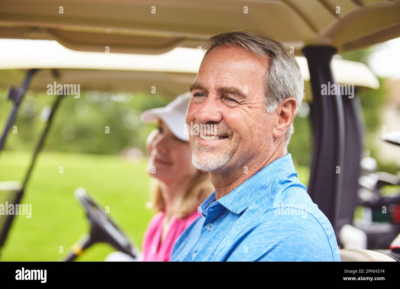Man relaxing in golf cart hi-res stock photography and images - Alamy