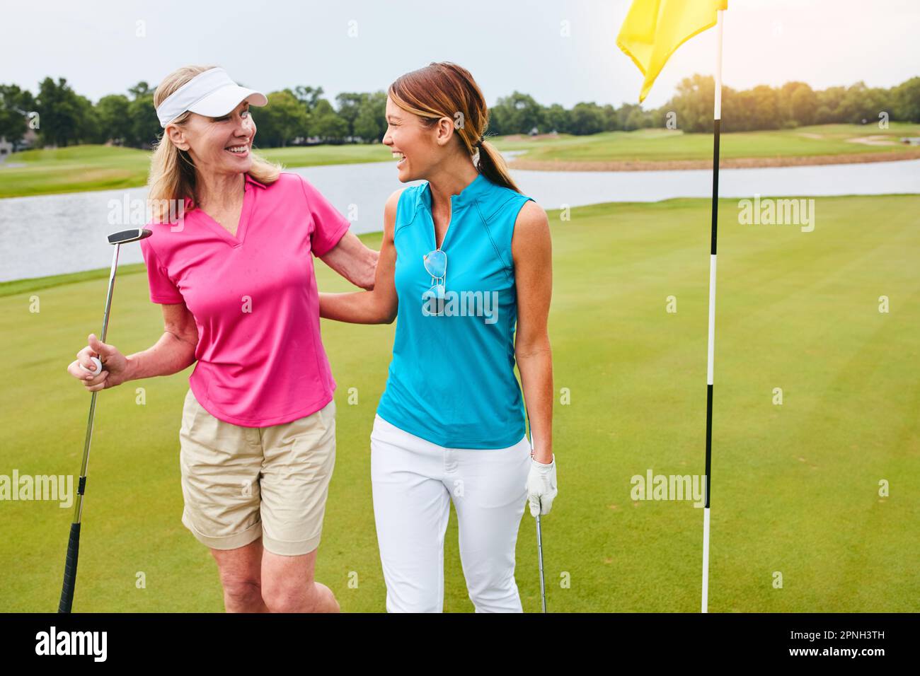 We have golf in common. two women out playing golf together Stock Photo ...