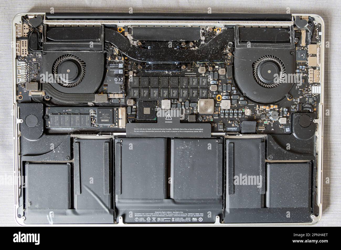 Riga, Latvia - March 14, 2023: Dust inside a laptop computer. The cause ...