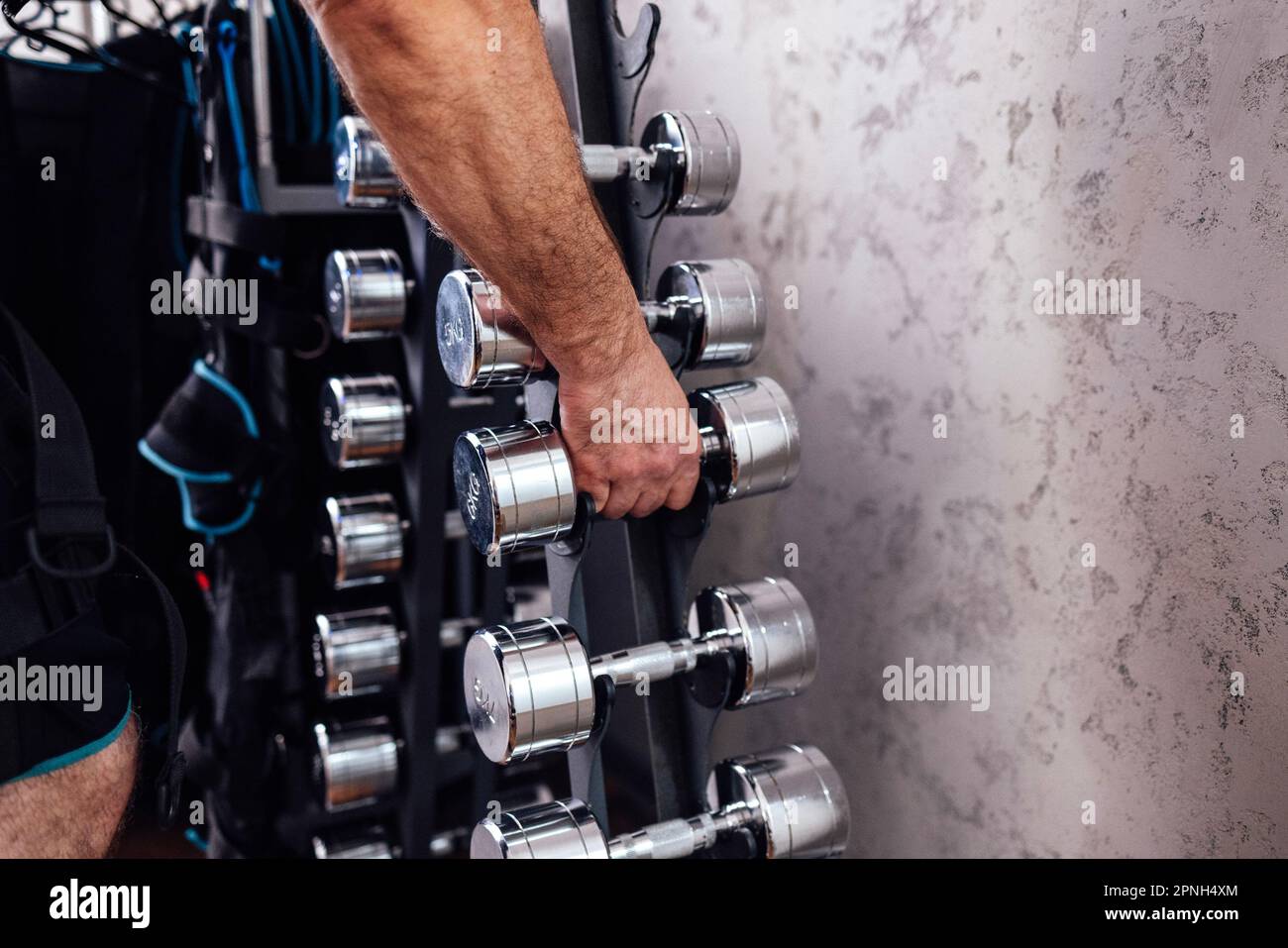 Athlete takes dumbbell training hi-res stock photography and images - Alamy