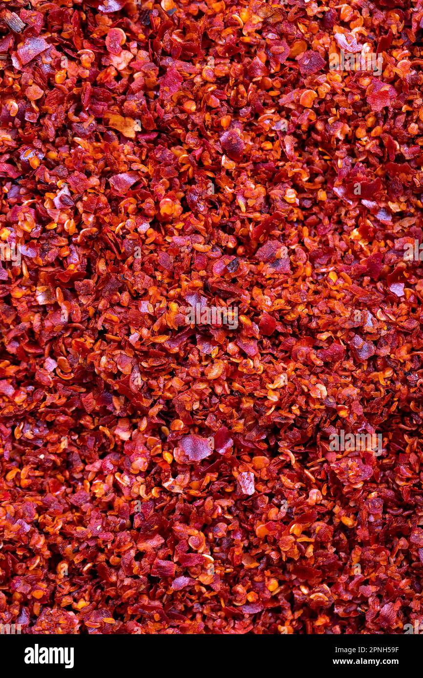 Red chili flakes. Crushed chili pepper or dried chili flakes background ...